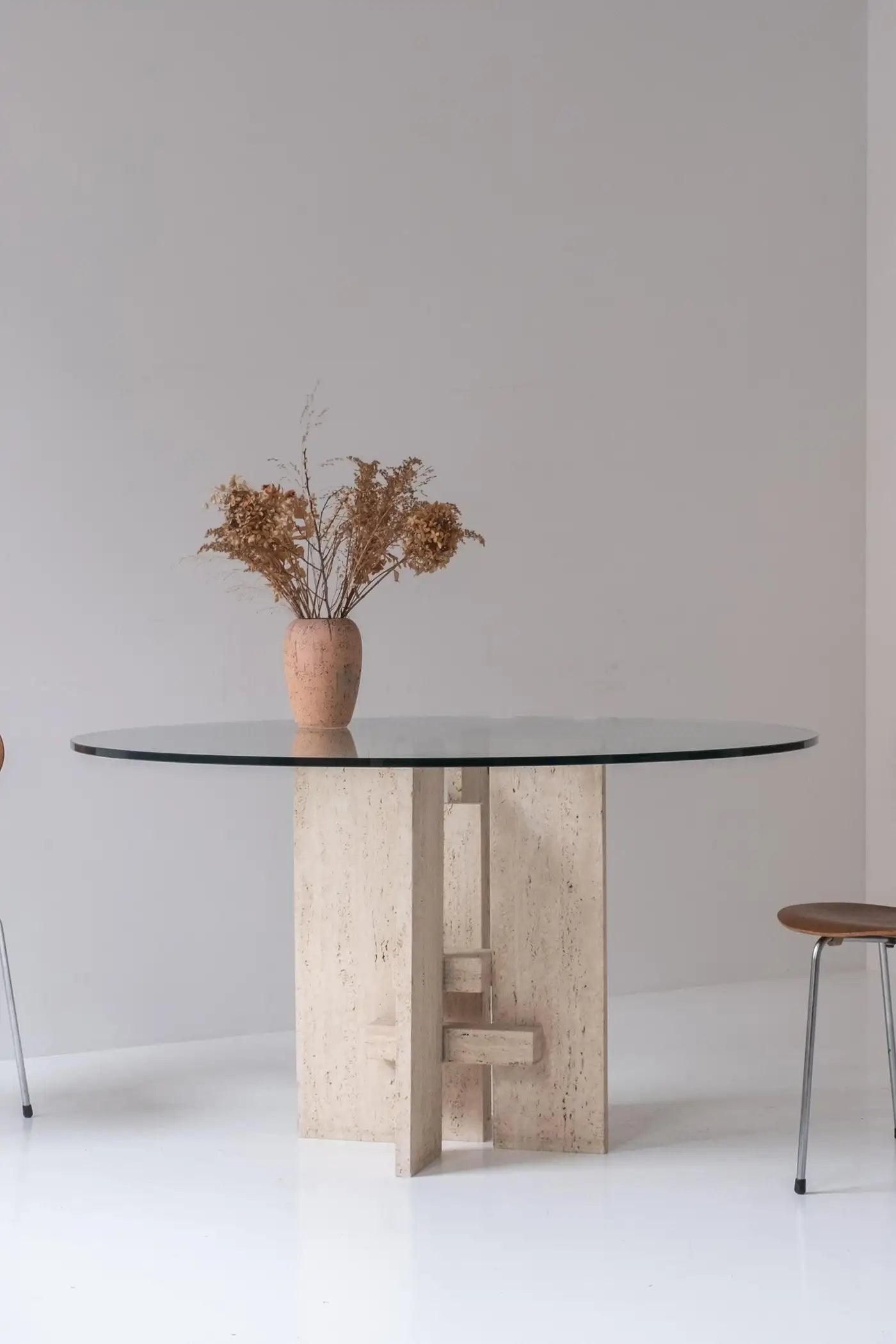 Travertine table with sculptural base designed – dill and johan